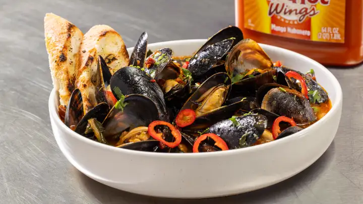 Steamed Mussels with Spicy Mango White Wine Broth | McCormick For Chefs®